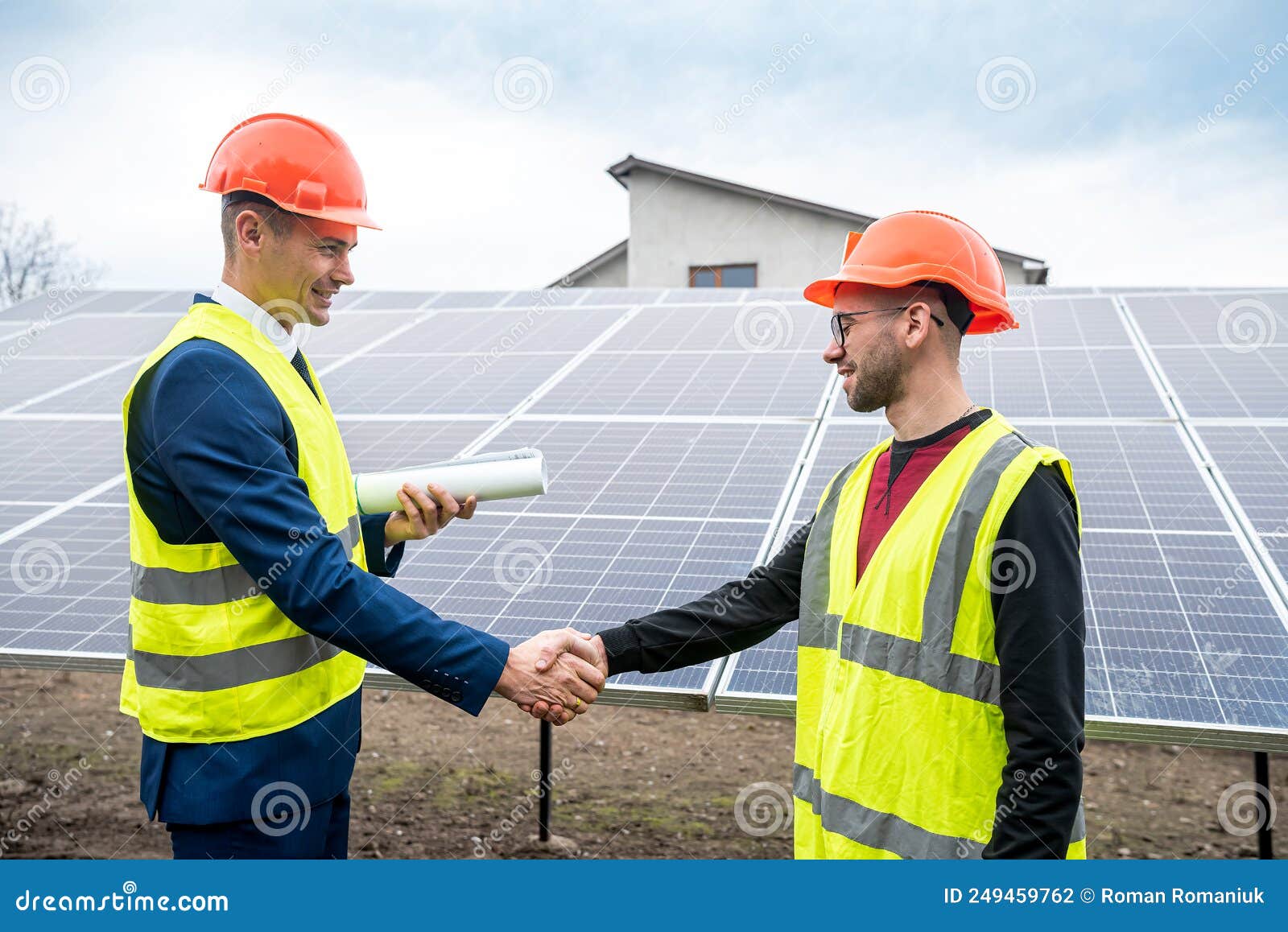 Workers in Helmets Two Men Shake Hands after Working on the ...