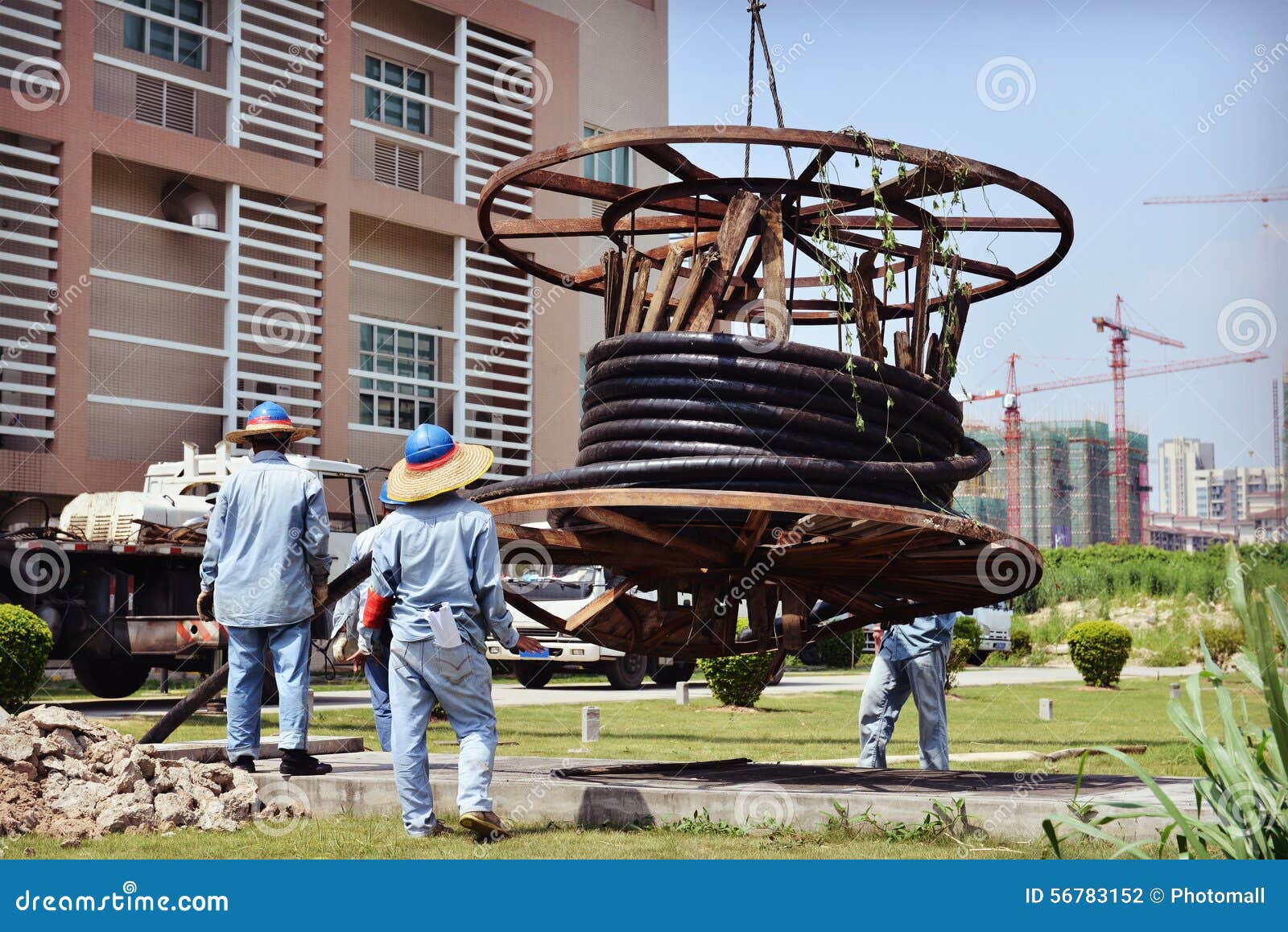 Workers Hoist Communication Cable Stock Photo - Image of workers, blue ...