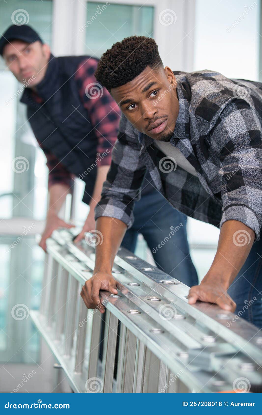 Workers Holding Ladder at Construction Site Stock Photo - Image of tool ...