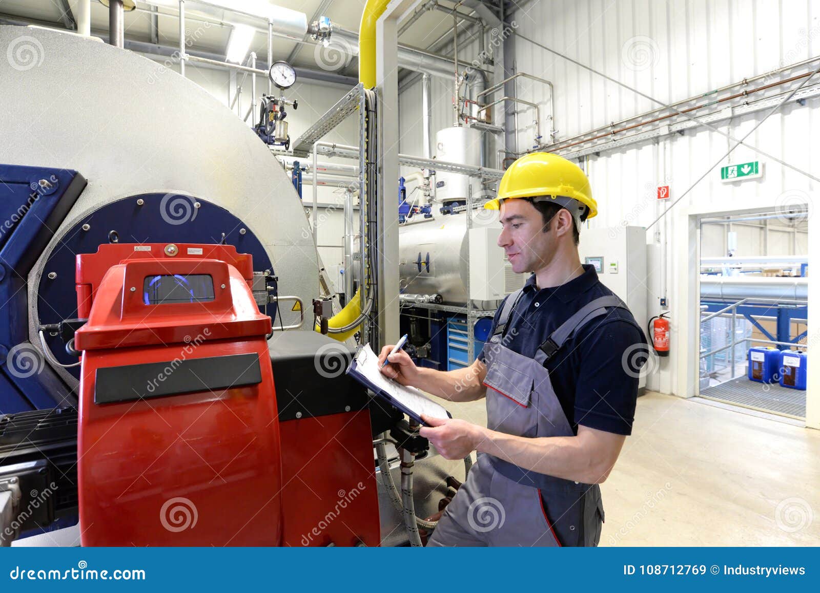 Workers in an Industrial Plant Check the Systems with Modern Technology ...