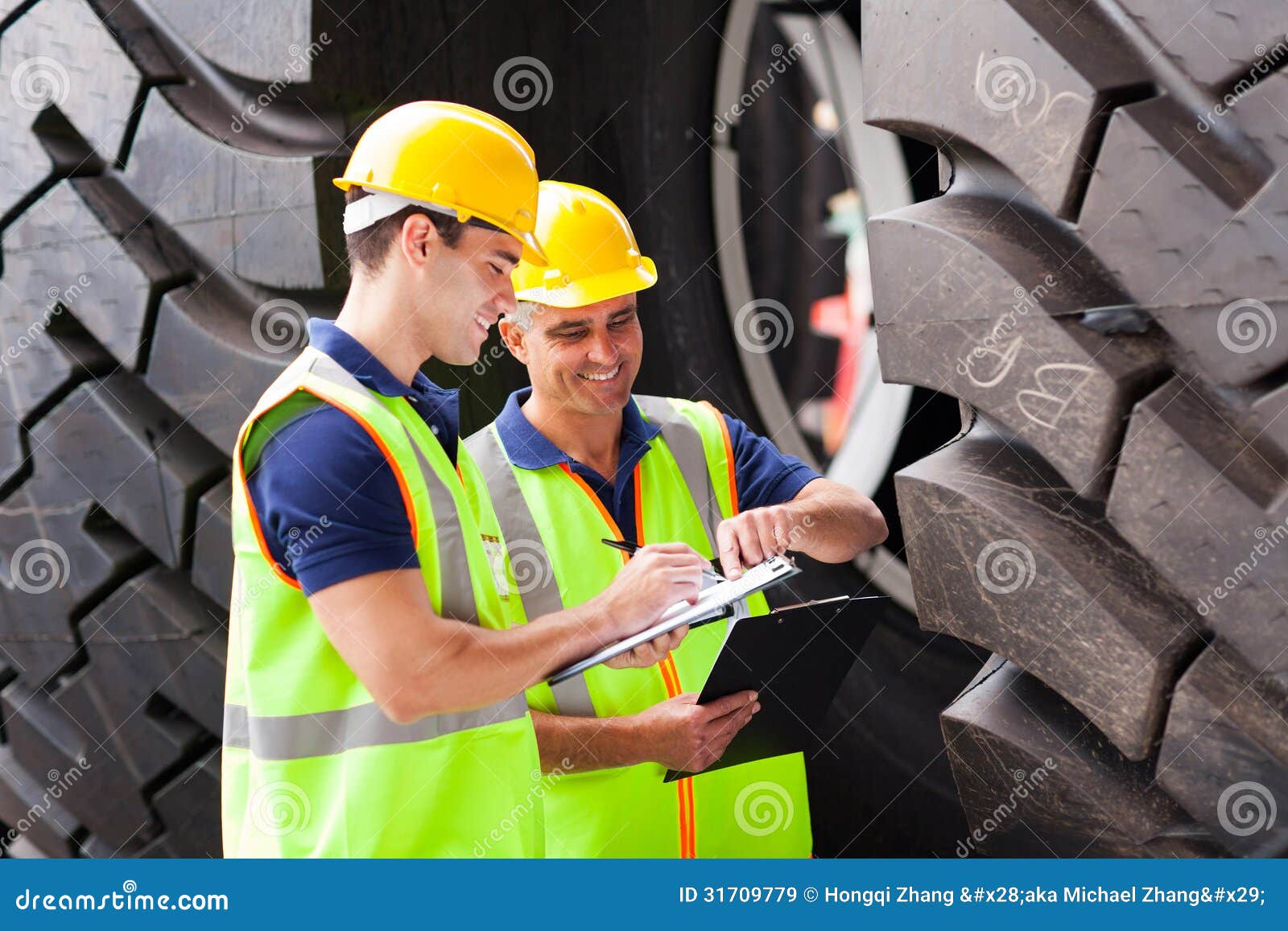 Workers inspecting tires stock image. Image of clipboard - 31709779