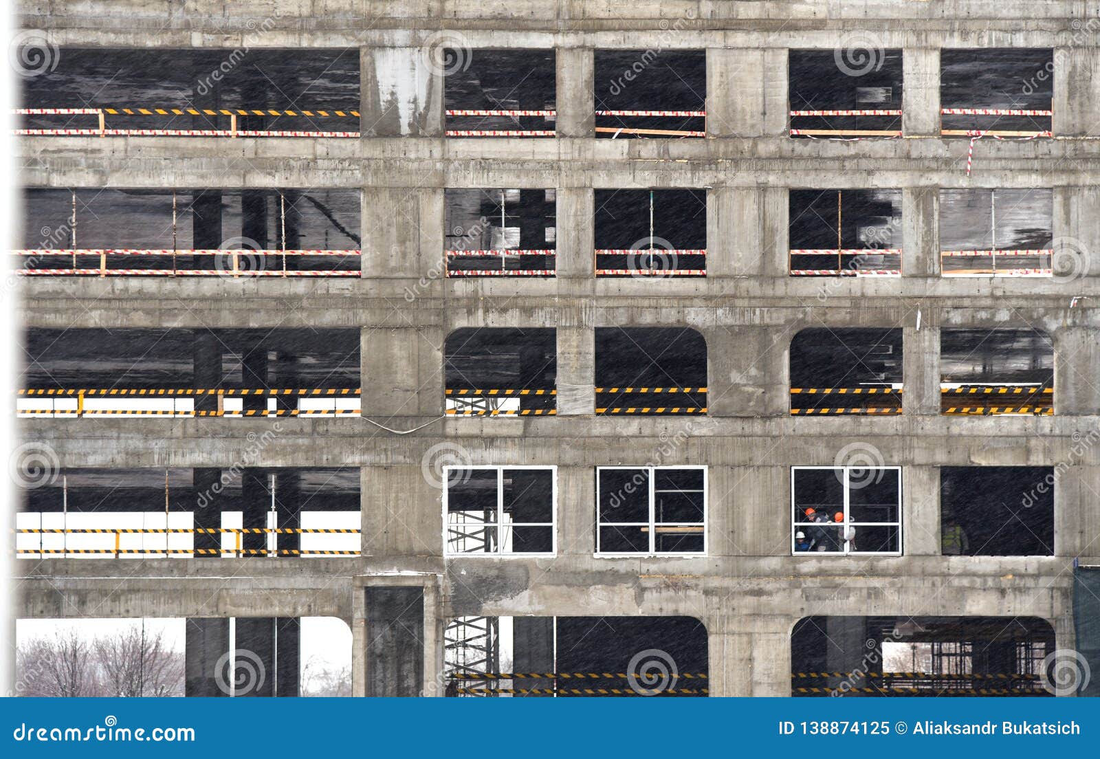 Workers Install Double-glazed Windows in a Building Under Construction ...