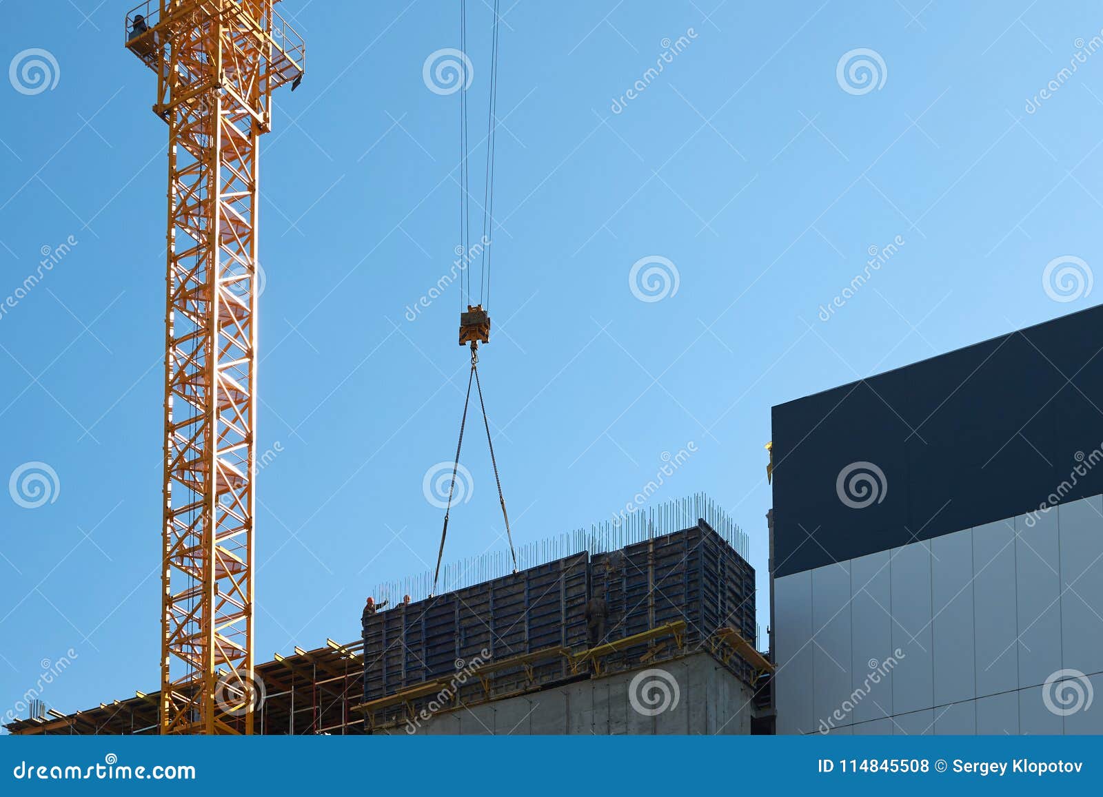 Workers Install Shields for Pouring Concrete in the Construction ...