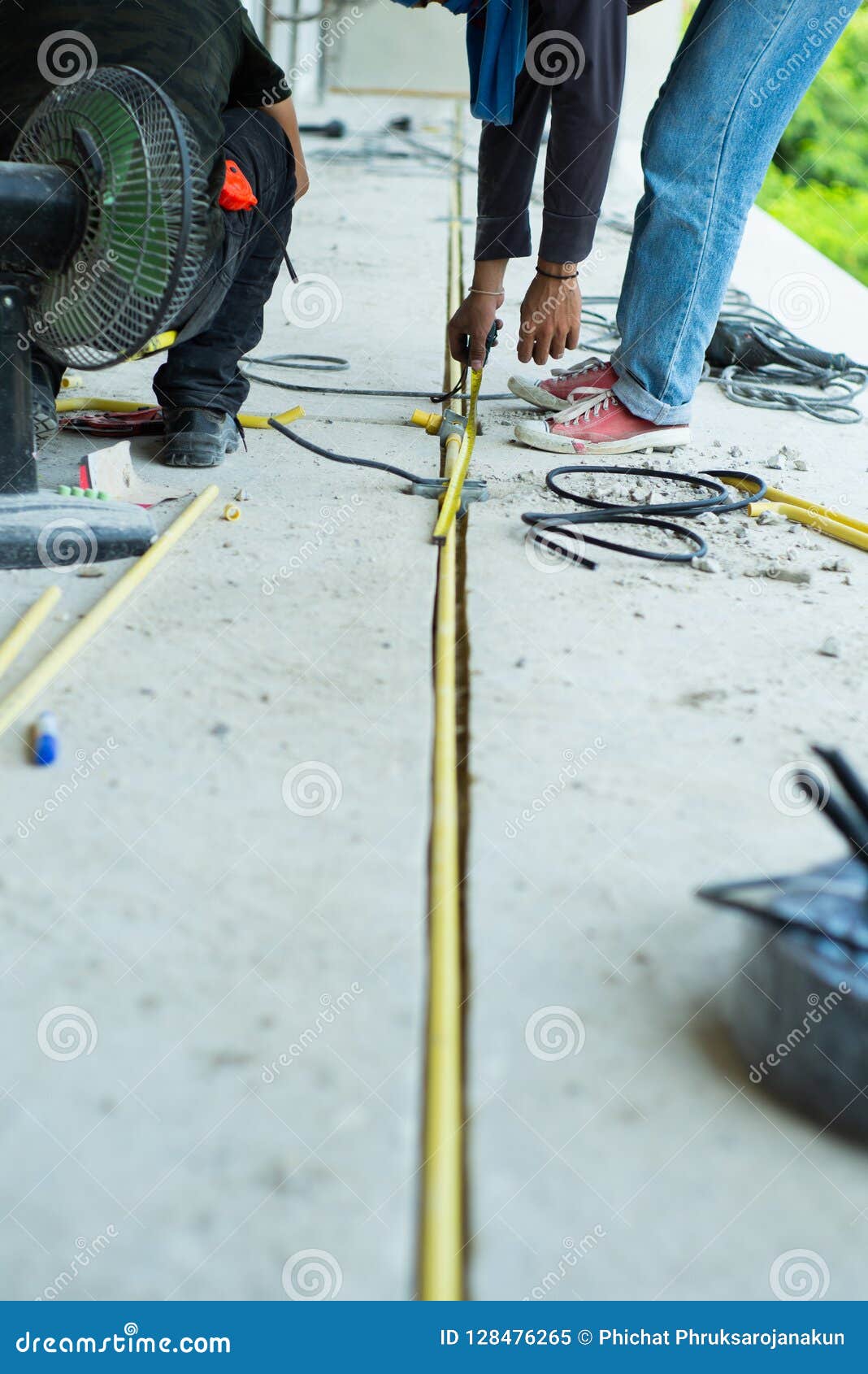 Workers Installing the Electrical Wire and Pipe in the House Under ...