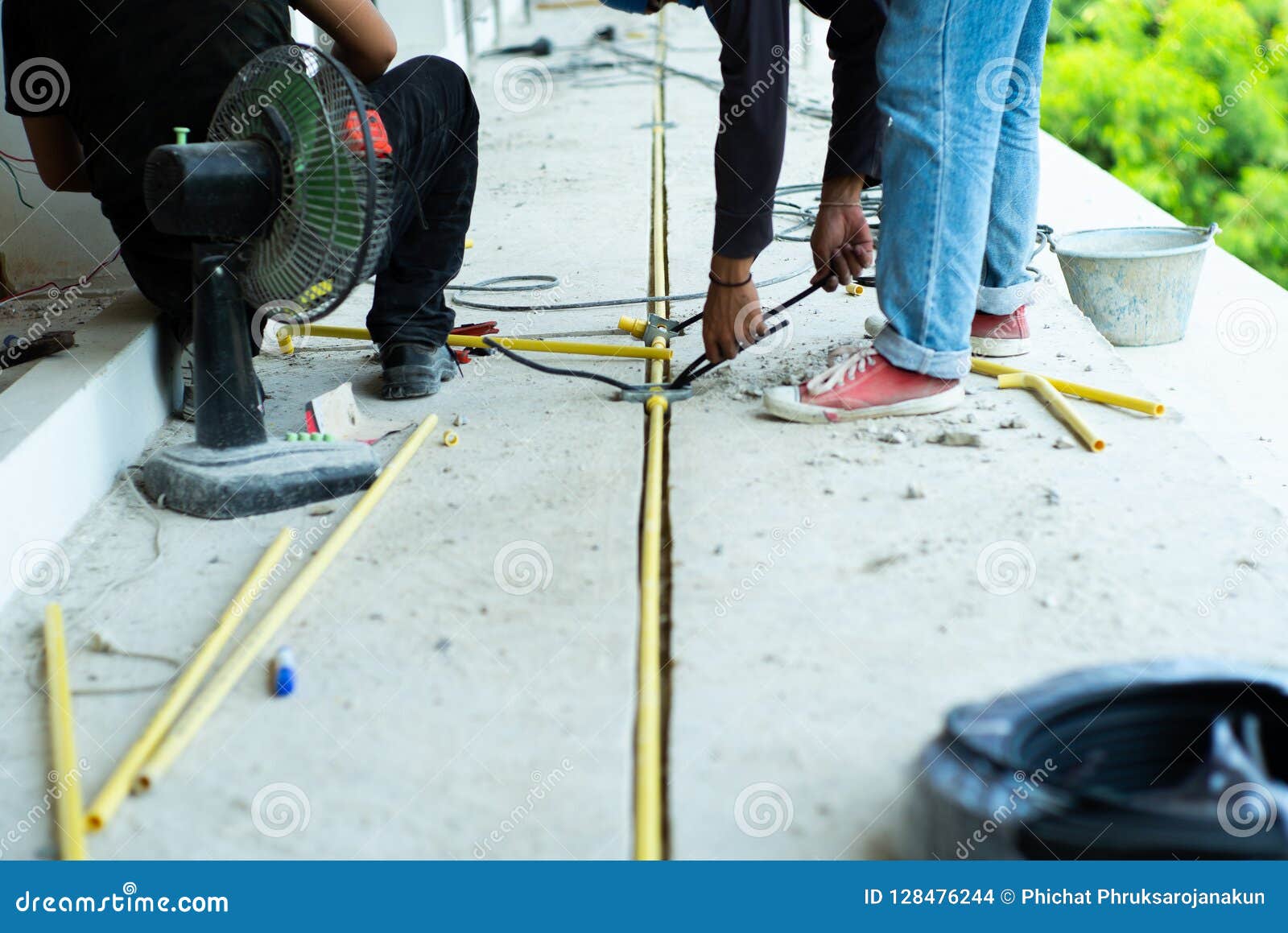 Workers Installing the Electrical Wire and Pipe in the House Under ...