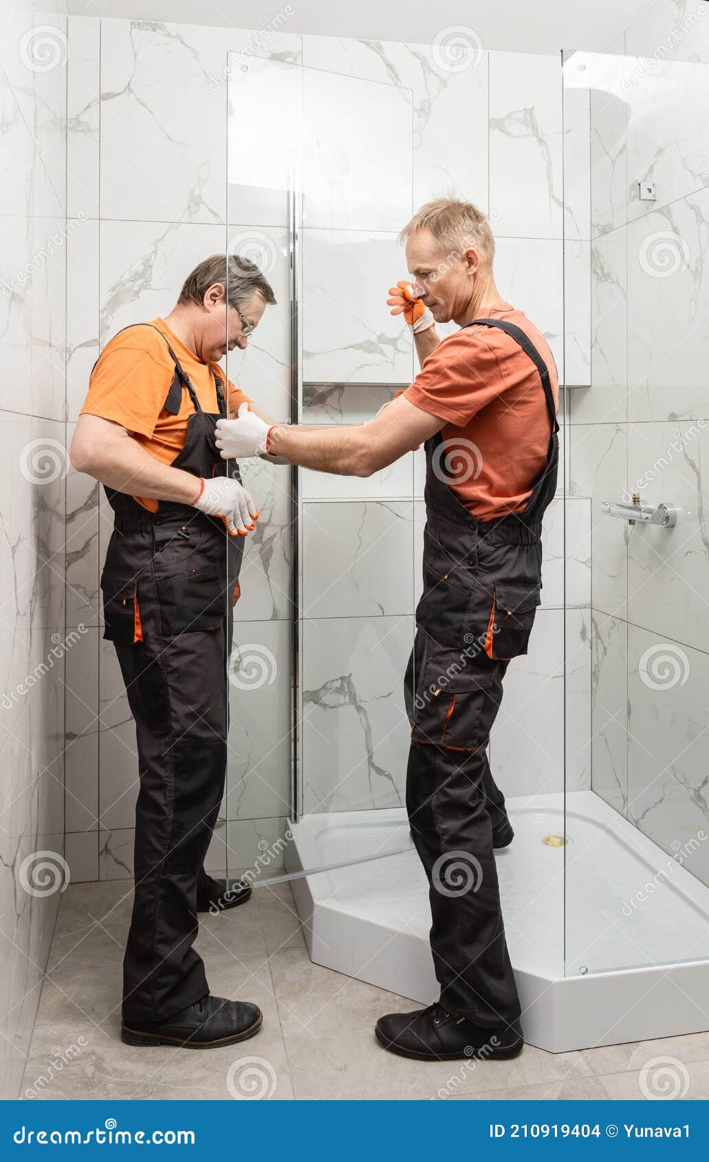 Workers are Installing a Wall Shower Enclosure Stock Photo - Image of ...