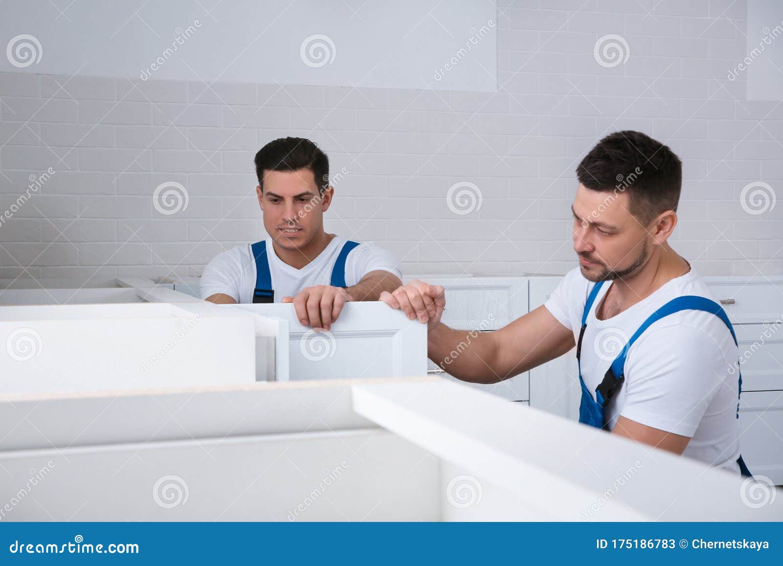 Workers Installing New Furniture in Kitchen Stock Image - Image of ...