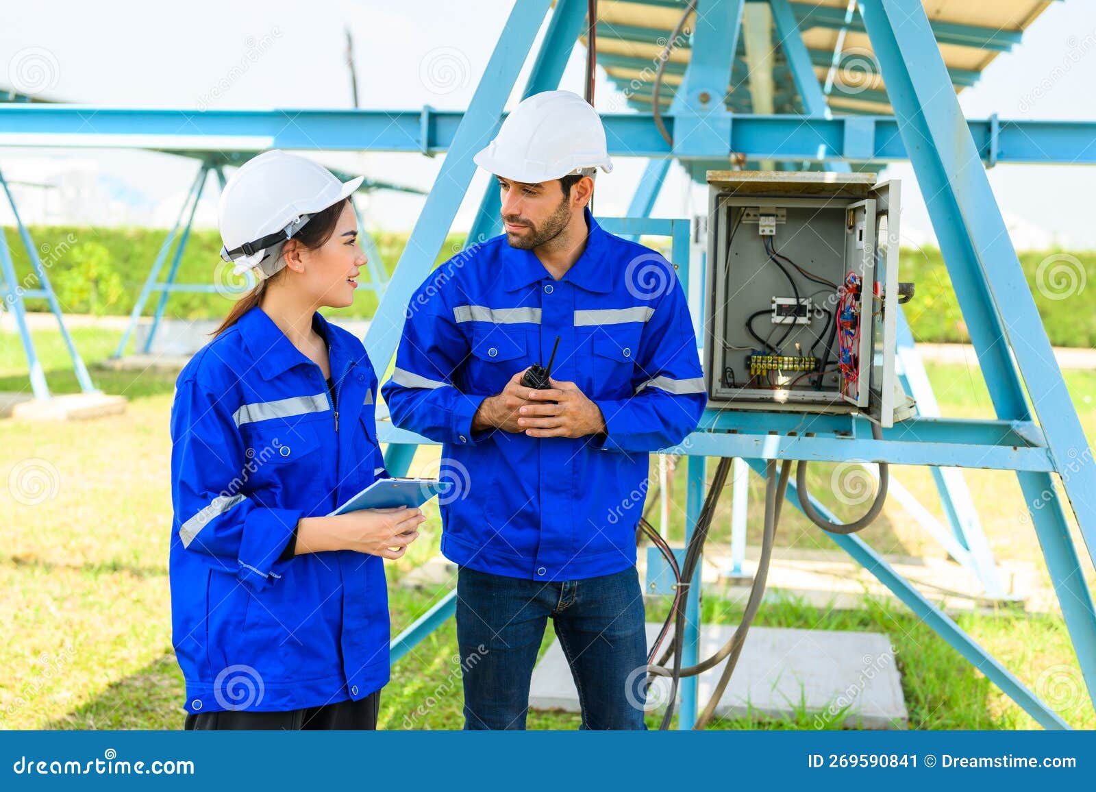 Workers Installing Solar Panels, Engineer Team at Solar Panel Farm ...