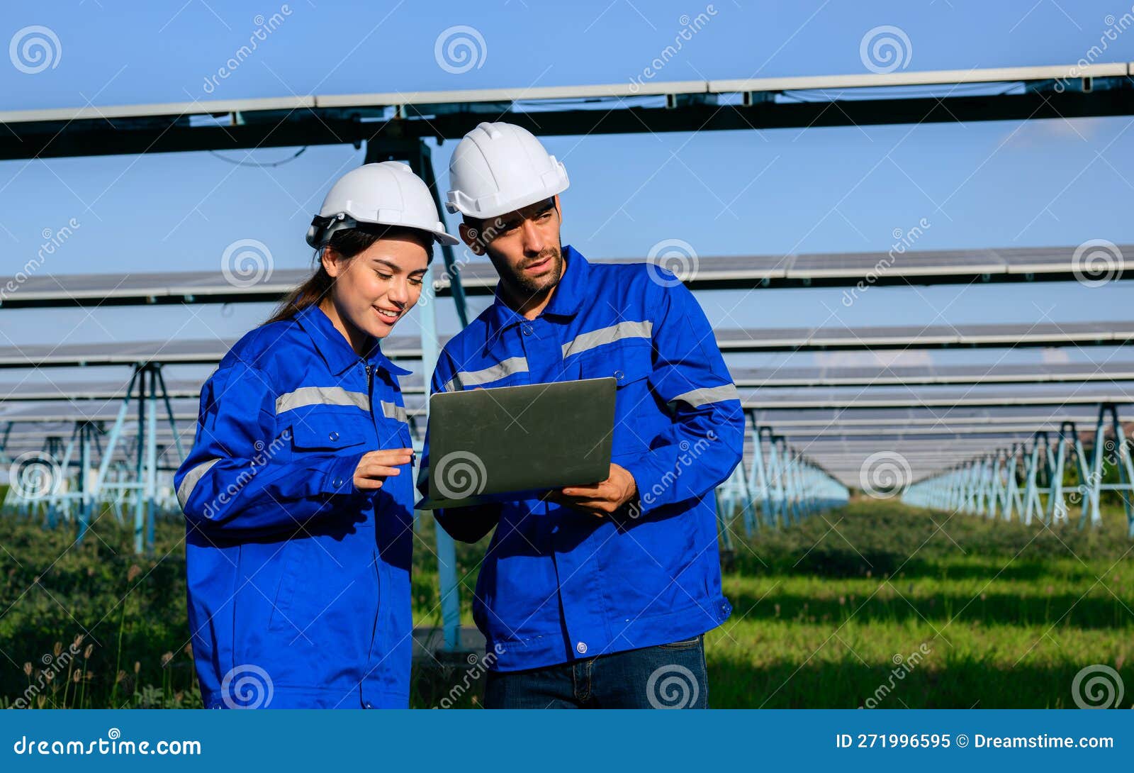 Workers Installing Solar Panels, Engineer Team at Solar Panel Farm ...