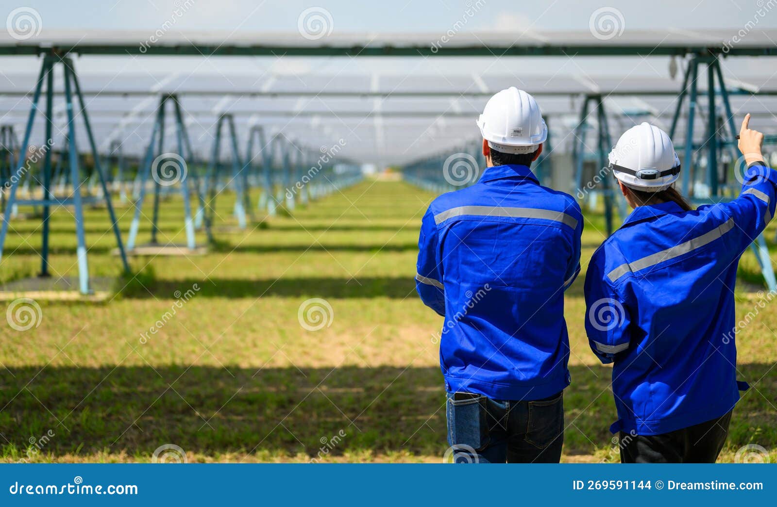 Workers Installing Solar Panels, Engineer Team at Solar Panel Farm ...