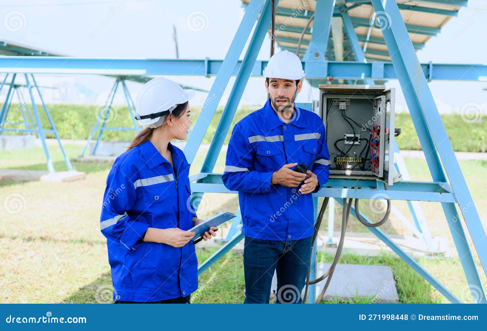 Workers Installing Solar Panels, Engineer Team at Solar Panel Farm ...