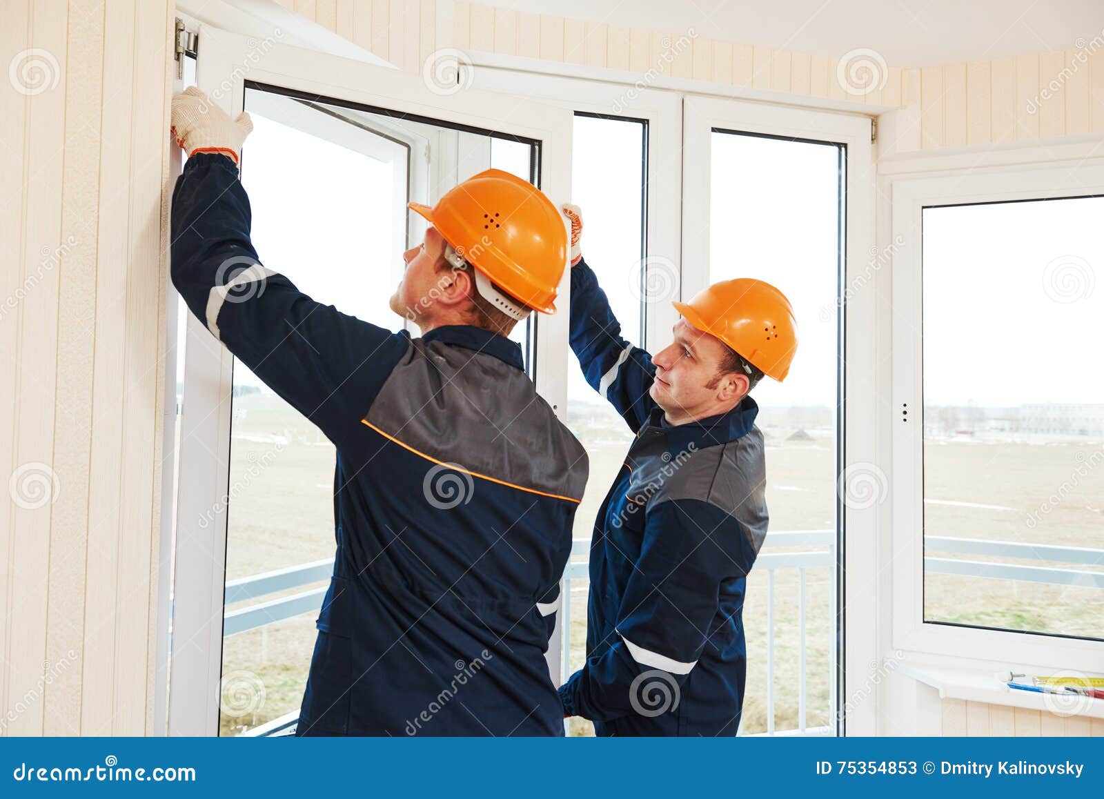 Workers installing window stock image. Image of labor - 75354853