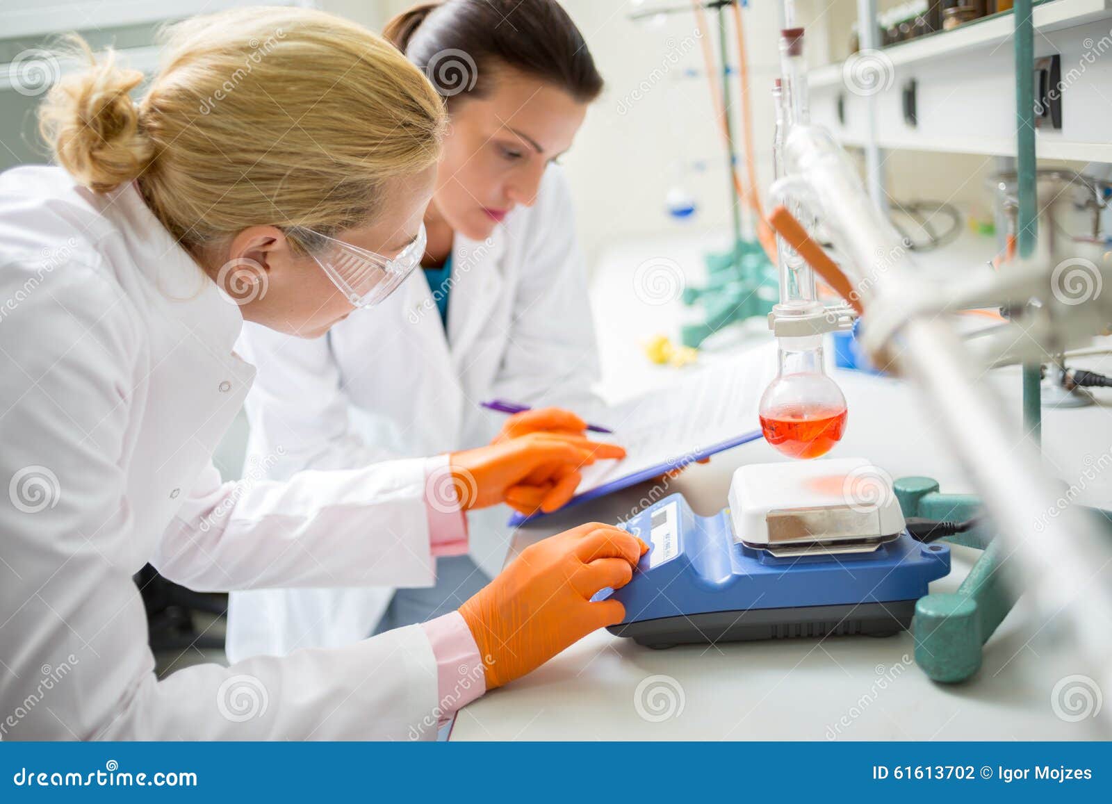 Workers in Lab Adjusting Measuring Instrument Stock Photo - Image of ...