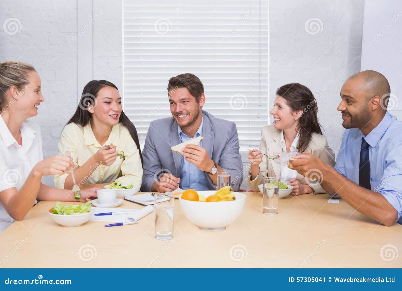 Workers Laughing while Enjoying Lunch Break Stock Image - Image of ...