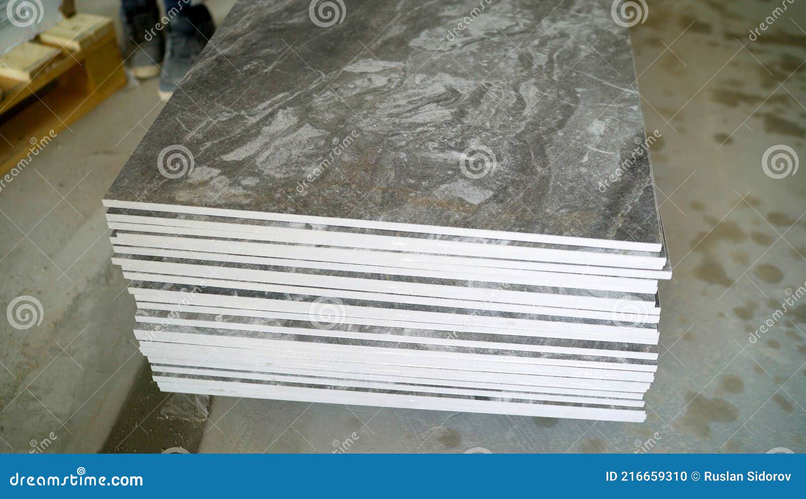 Installing a Large Ceramic Tile. Workers are Laying Large Tiles Over a ...