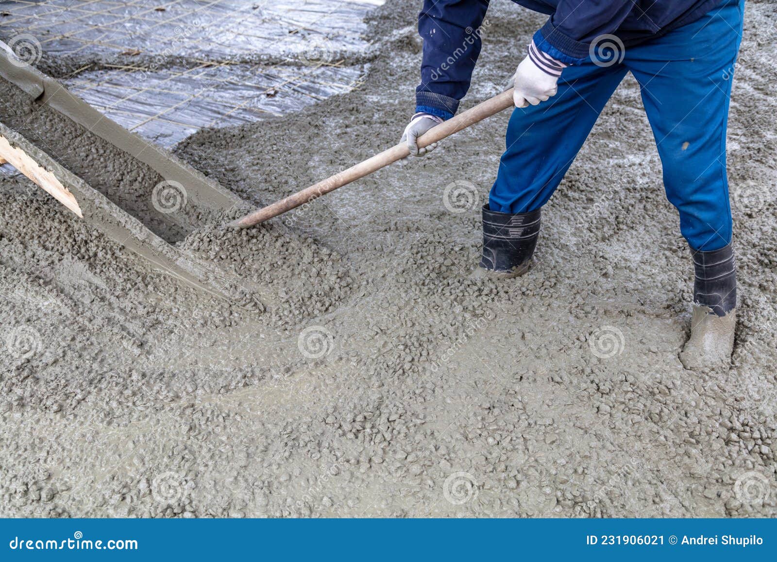 Workers Level Out the Concrete Mix at a Construction Site. Stock Image ...