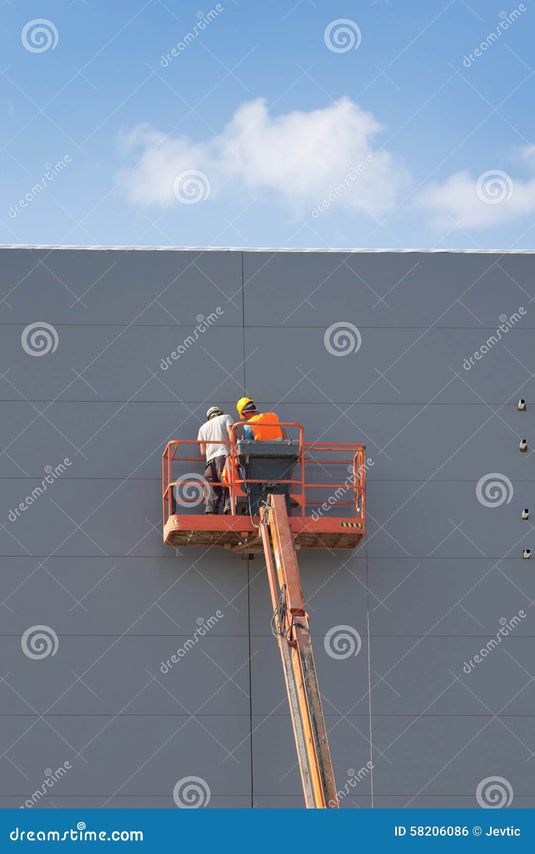 Workers in lifting cage stock photo. Image of height - 58206086