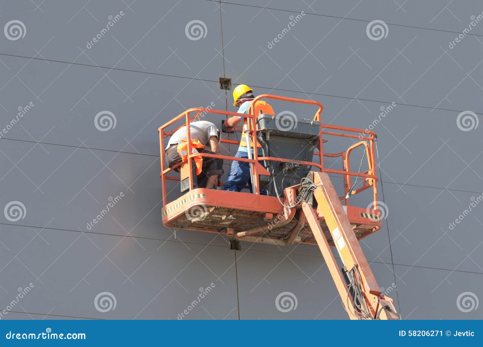 Workers in lifting cage stock image. Image of profession - 58206271