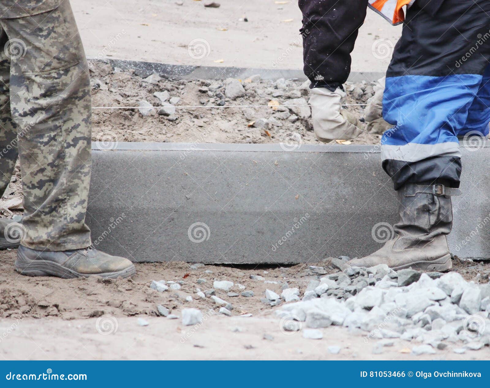 Workers are Lifting Concrete Curb. Concrete Kerb Installation at ...