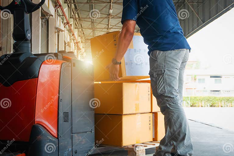 Workers Lifting Package Boxes Stacking on Pallet. Cartons, Cardboard ...