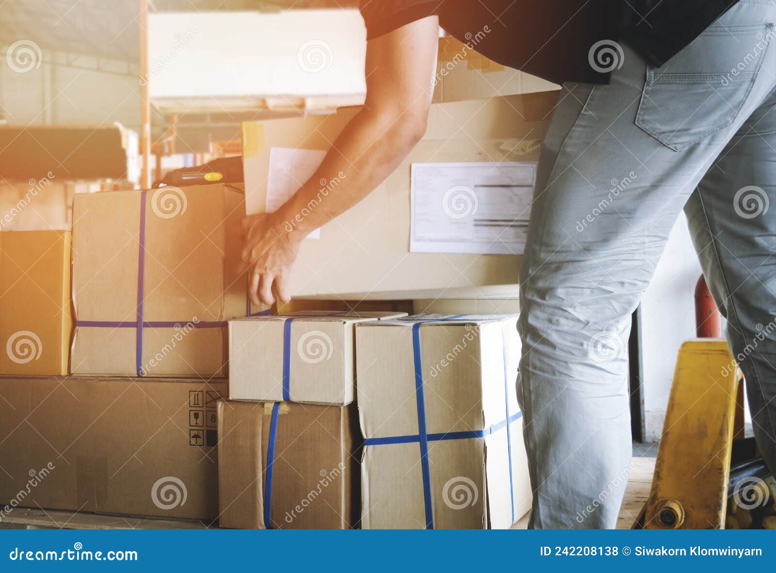 Workers Lifting Packaging Boxes in the Warehouse. Commerce Supply Chain ...