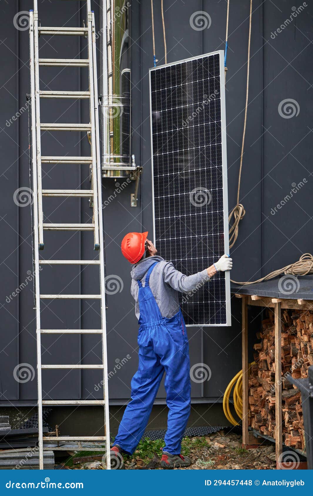 Workers Lifting Up Photovoltaic Solar Module while Installing Solar ...