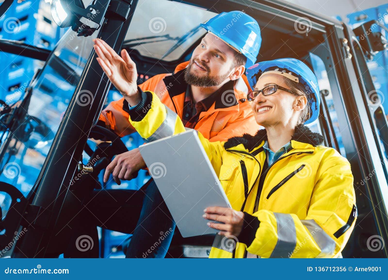 Workers in Logistics Warehouse Checking the Inventory Stock Photo ...