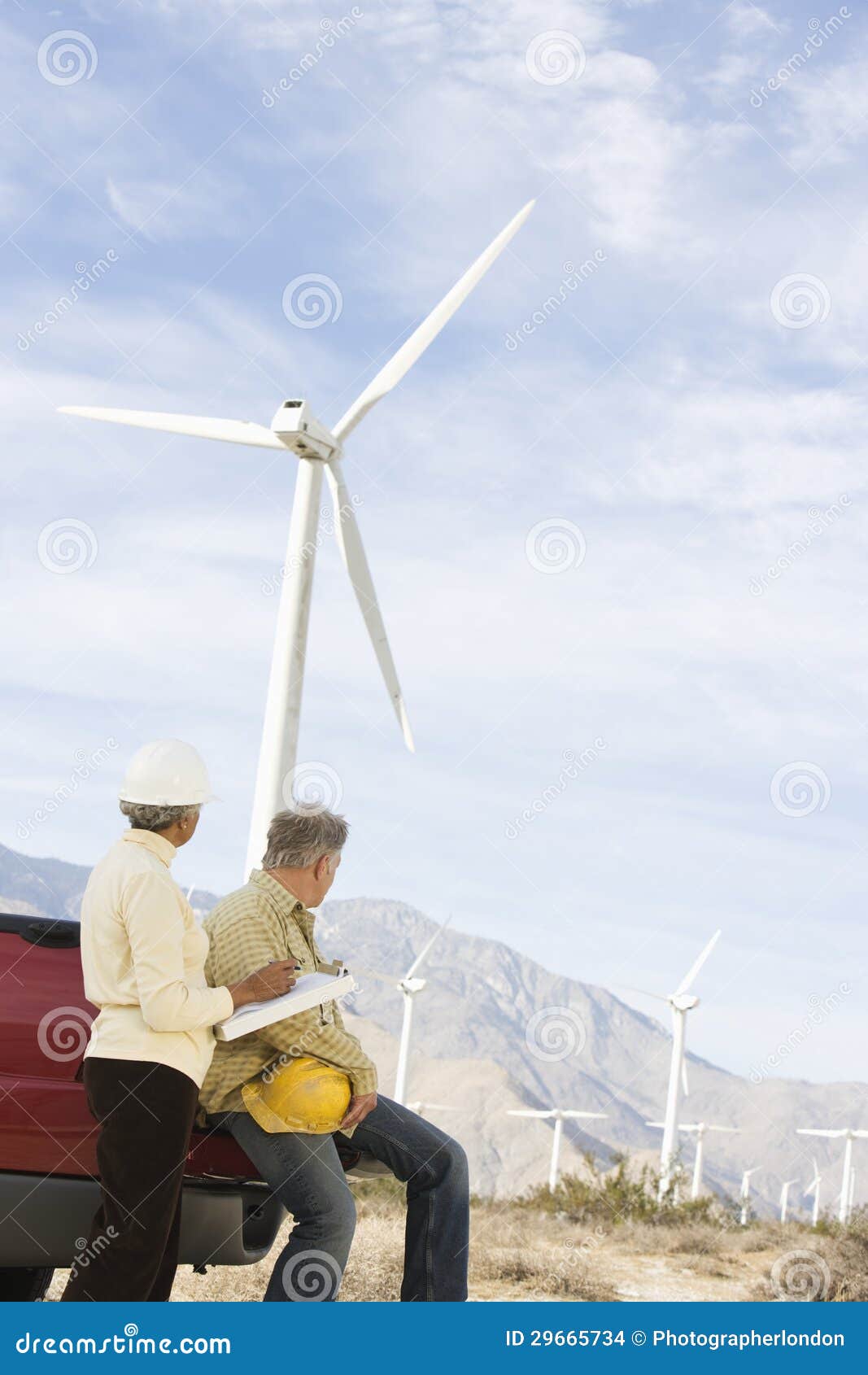 Workers Looking at Wind Farm Stock Photo - Image of clipboard, outdoors ...