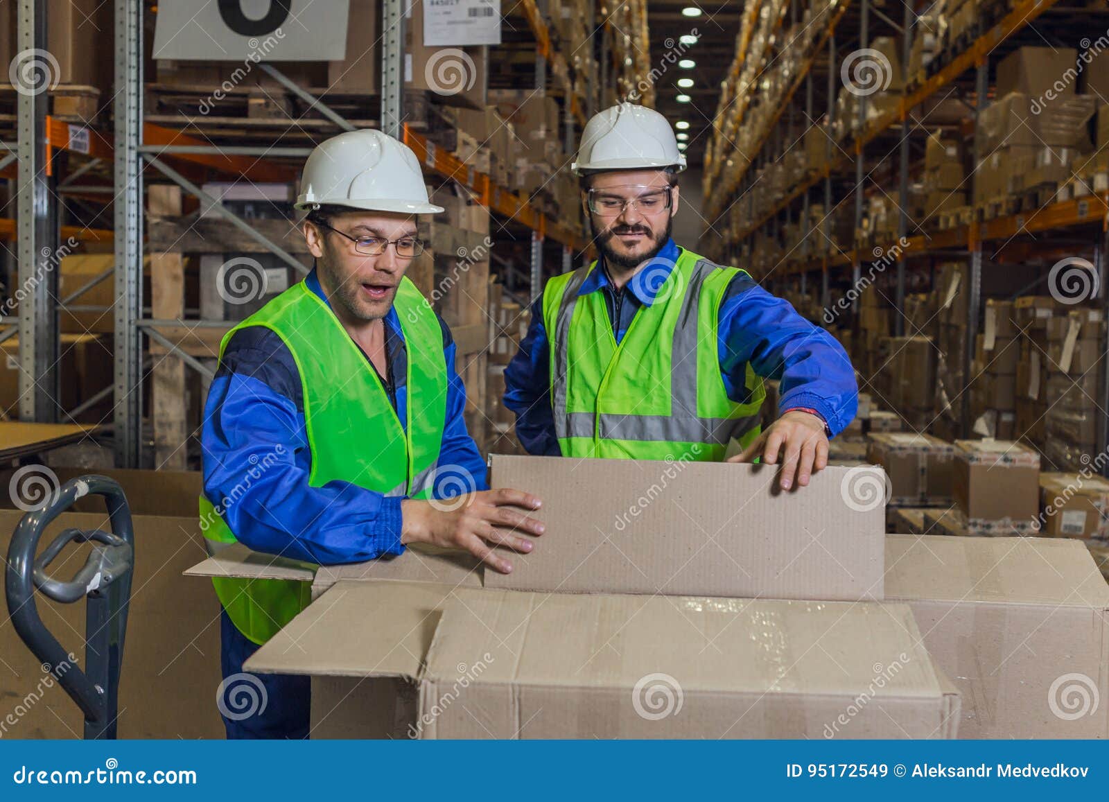 Workers Looking Inside Boxes Stock Image - Image of business, warehouse ...
