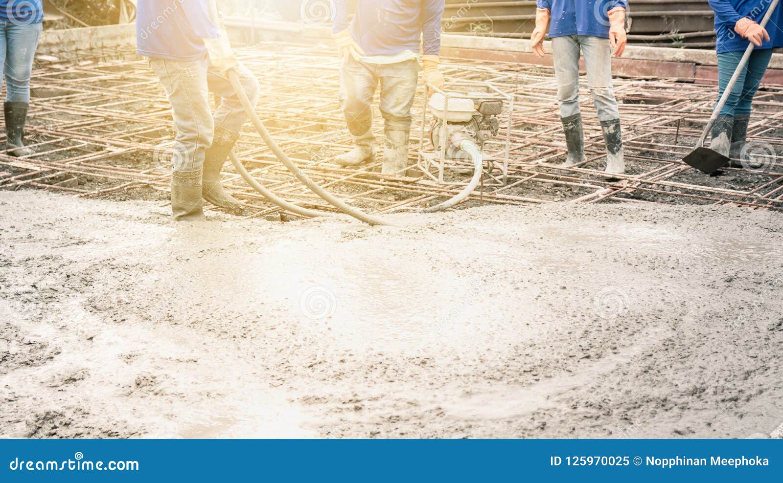 Workers Man Using A Vibration Machine For Eliminate Bubbles In Concrete ...