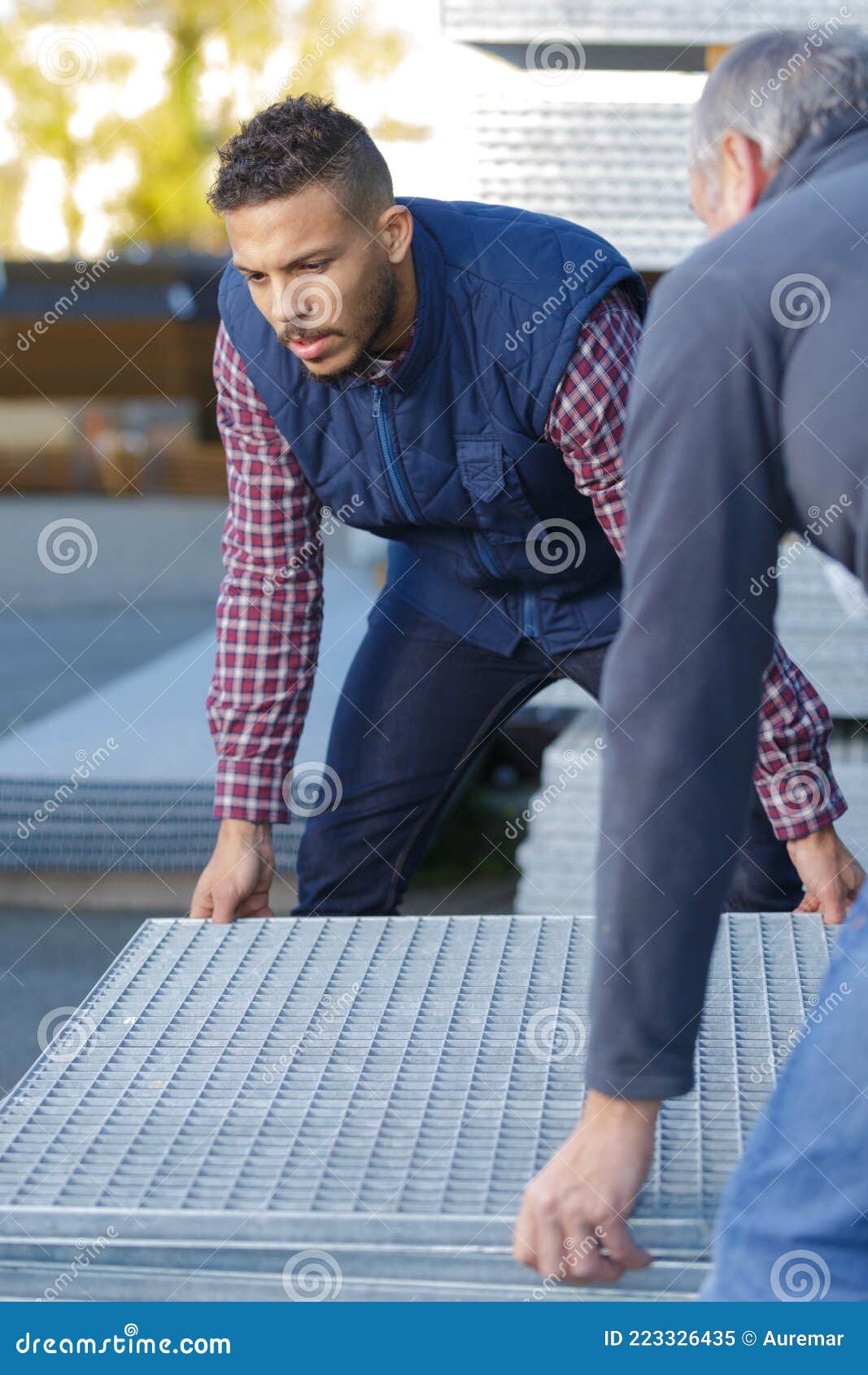 Workers Moving Metal Sheets Outside Factory Stock Image - Image of ...