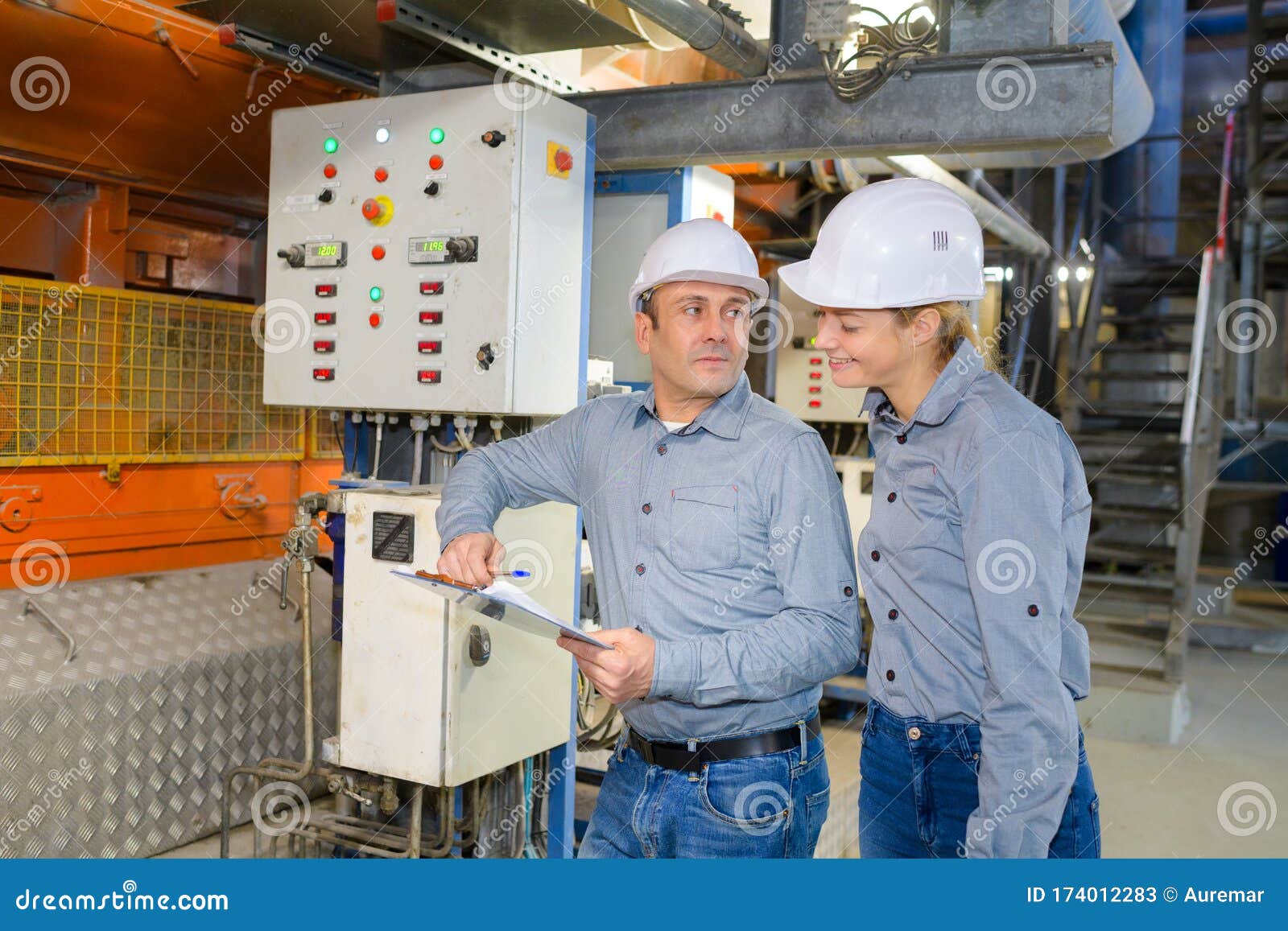 Workers Operating Machinery in Factory Stock Image - Image of colleague ...