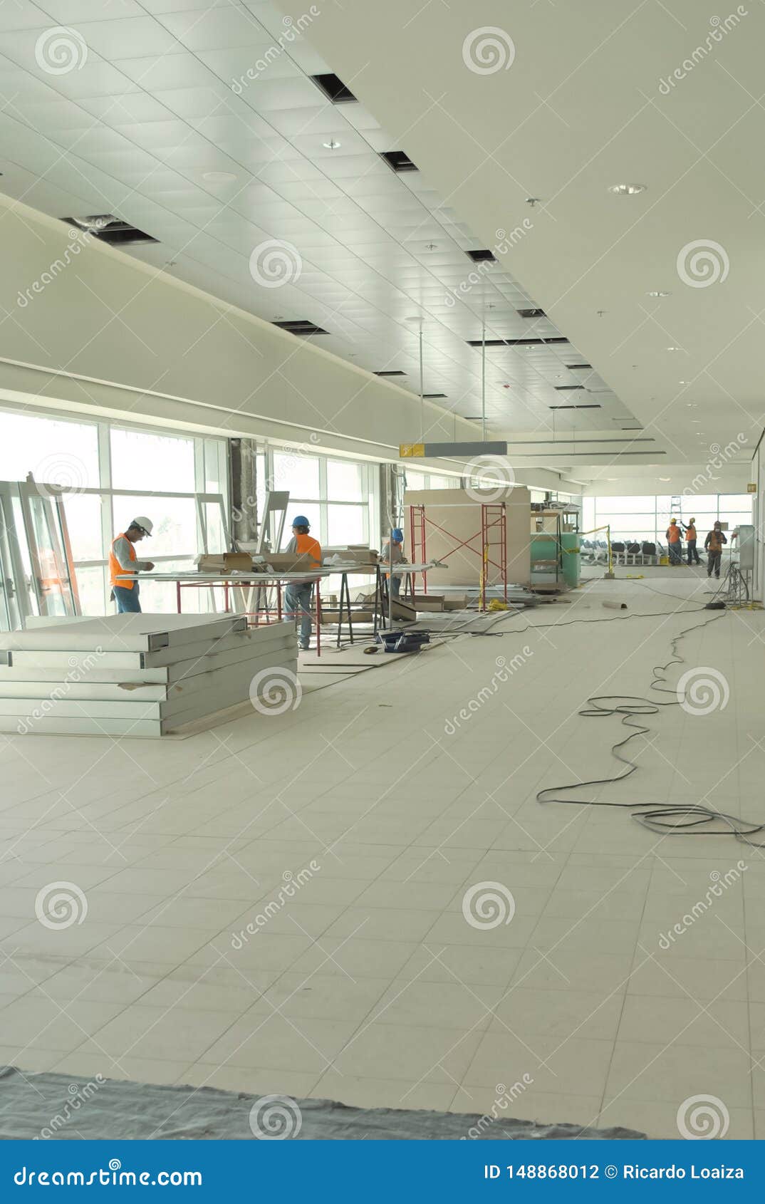 Workers Organizing Work Material within a Construction. Editorial ...