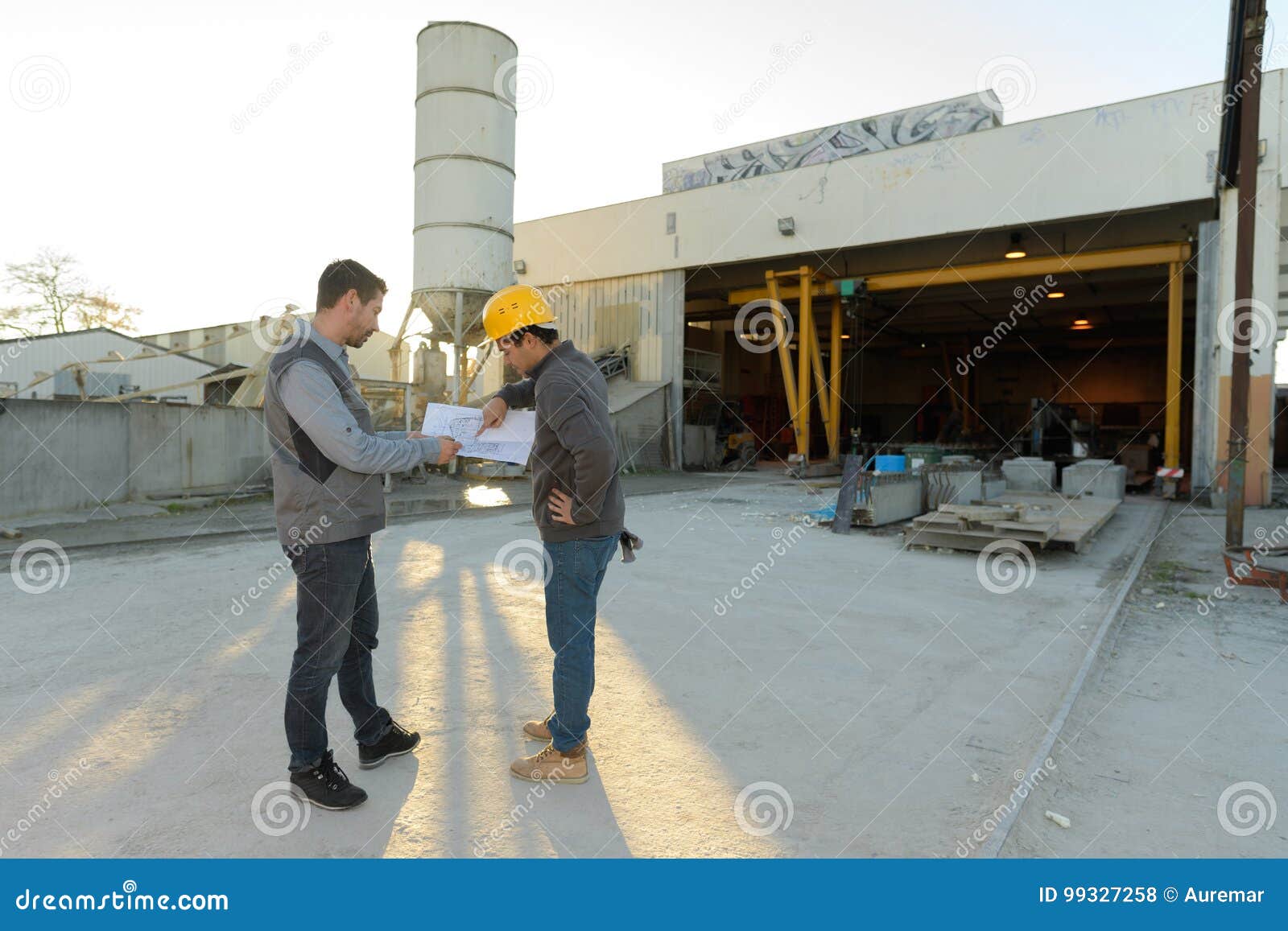 Workers outside factory stock photo. Image of project - 99327258