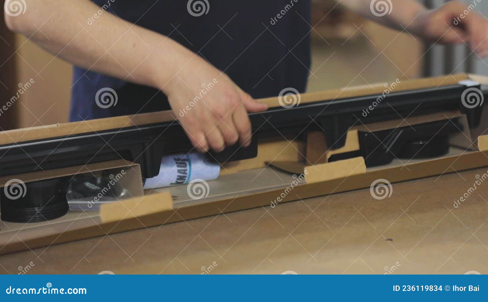 Workers Pack Finished Products into a Box. Packaging of Finished Goods ...