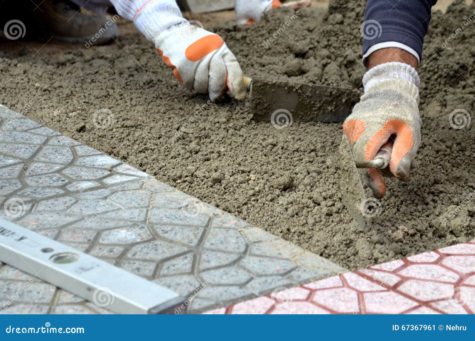 Workers paving walkway stock image. Image of bricklaying - 67367961