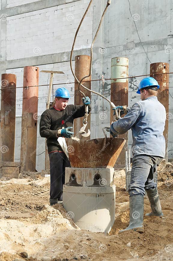 Workers at piling works stock photo. Image of action - 14026524