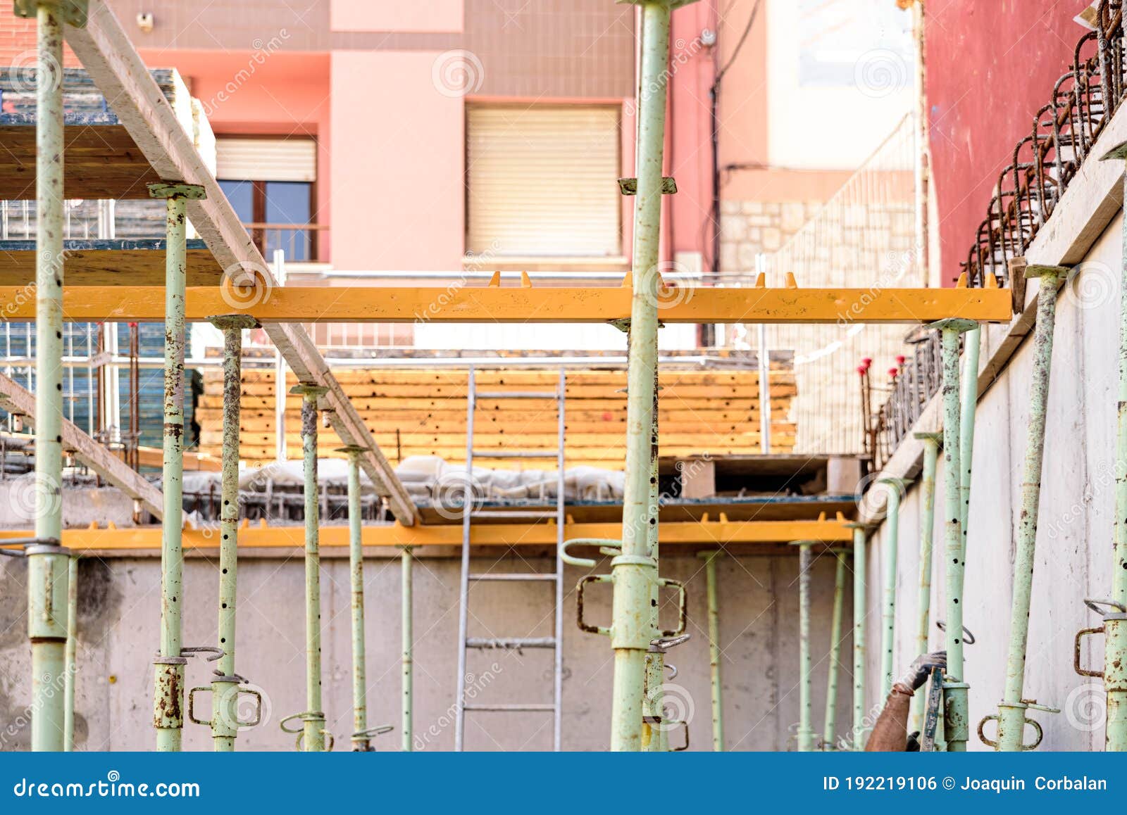 Workers Placing Support Bars To Cement the Structure of a Building with ...