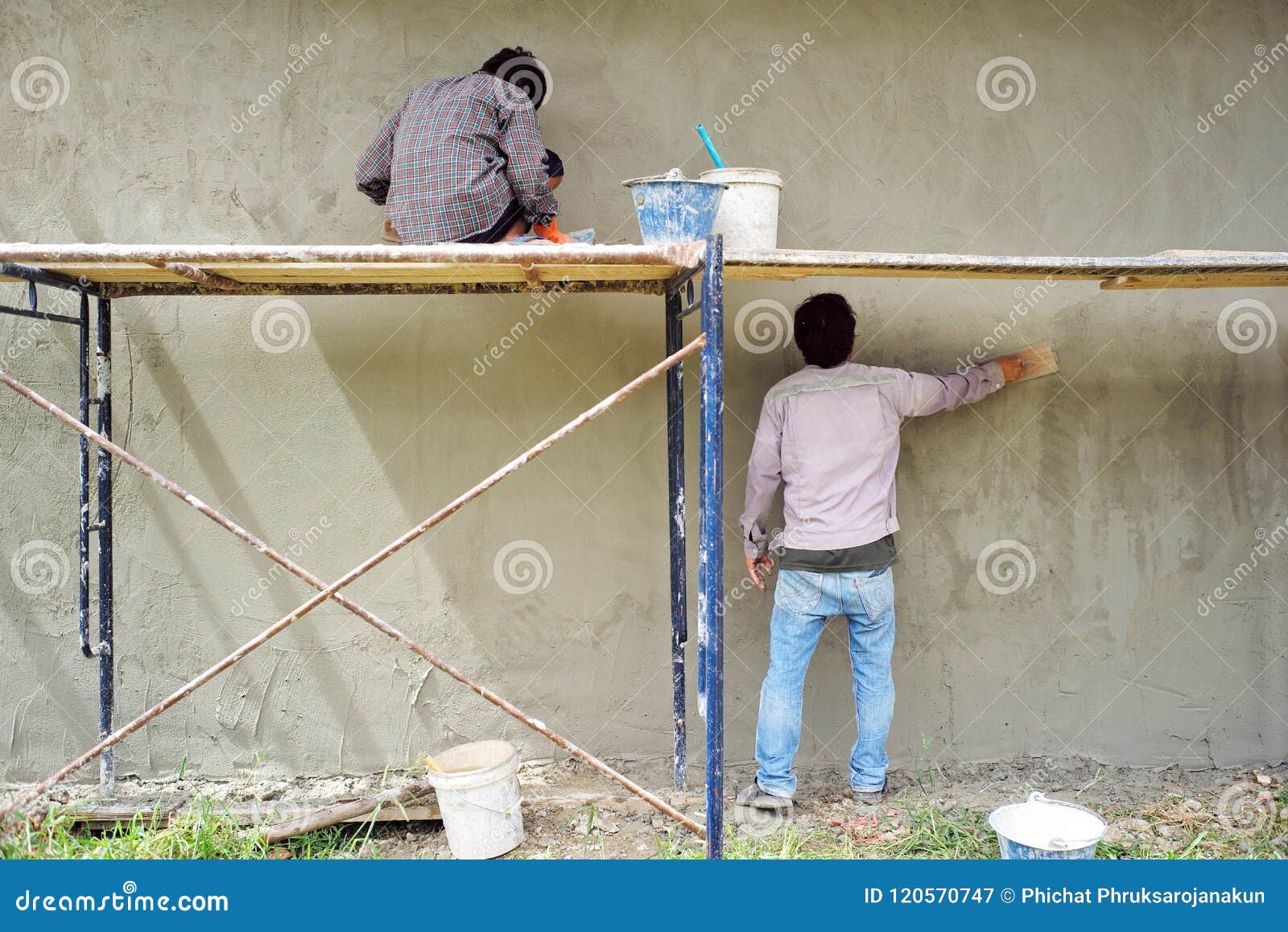 Workers Plastering the Brickwork Wall by the Cement Texture for the ...