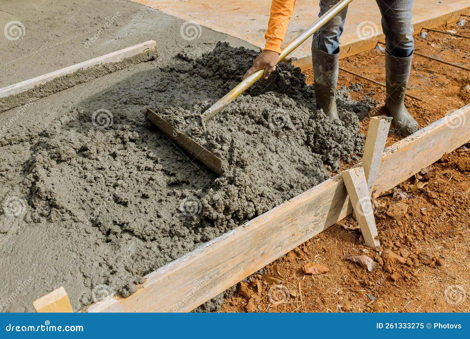 Workers Pour Cement To Create an Additional Sidewalk To Be Built on the ...