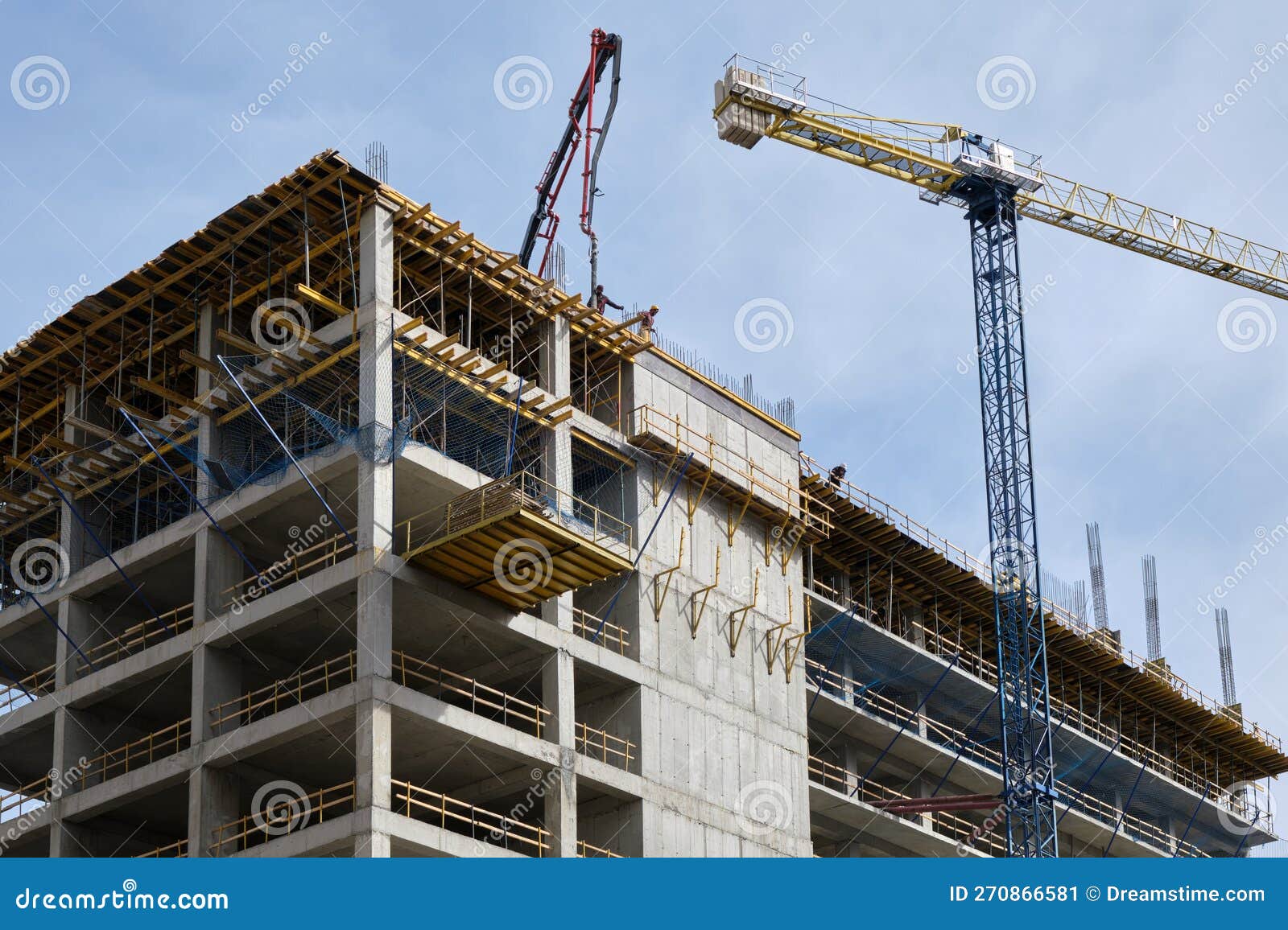 Workers Pour Concrete at the Construction Site of a New Residential ...