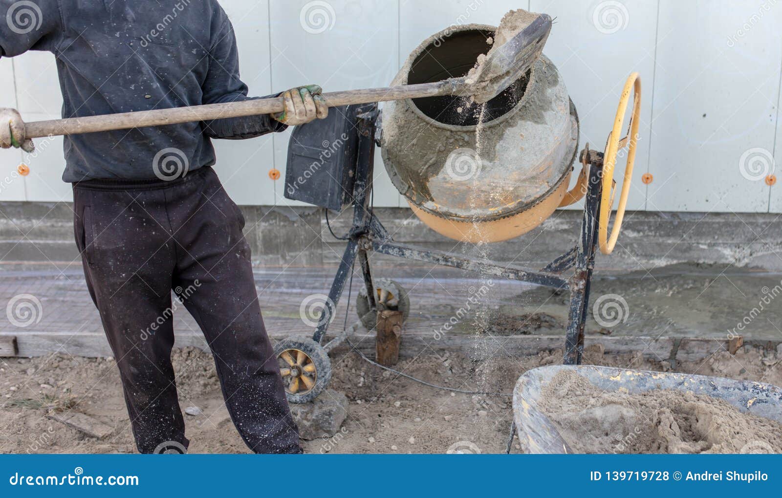 Workers Pour Concrete Solution at a Construction Site Stock Photo ...