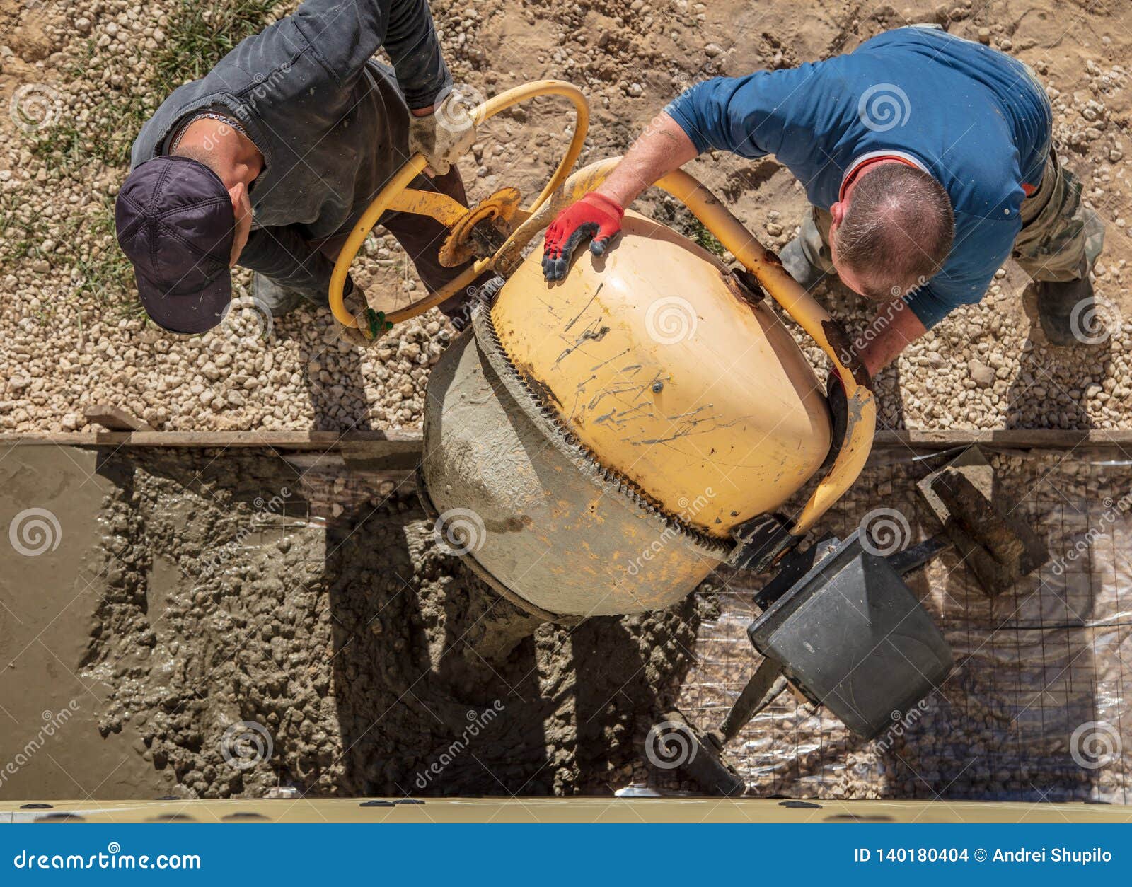 Workers Pour Concrete Solution at a Construction Site Editorial Stock ...