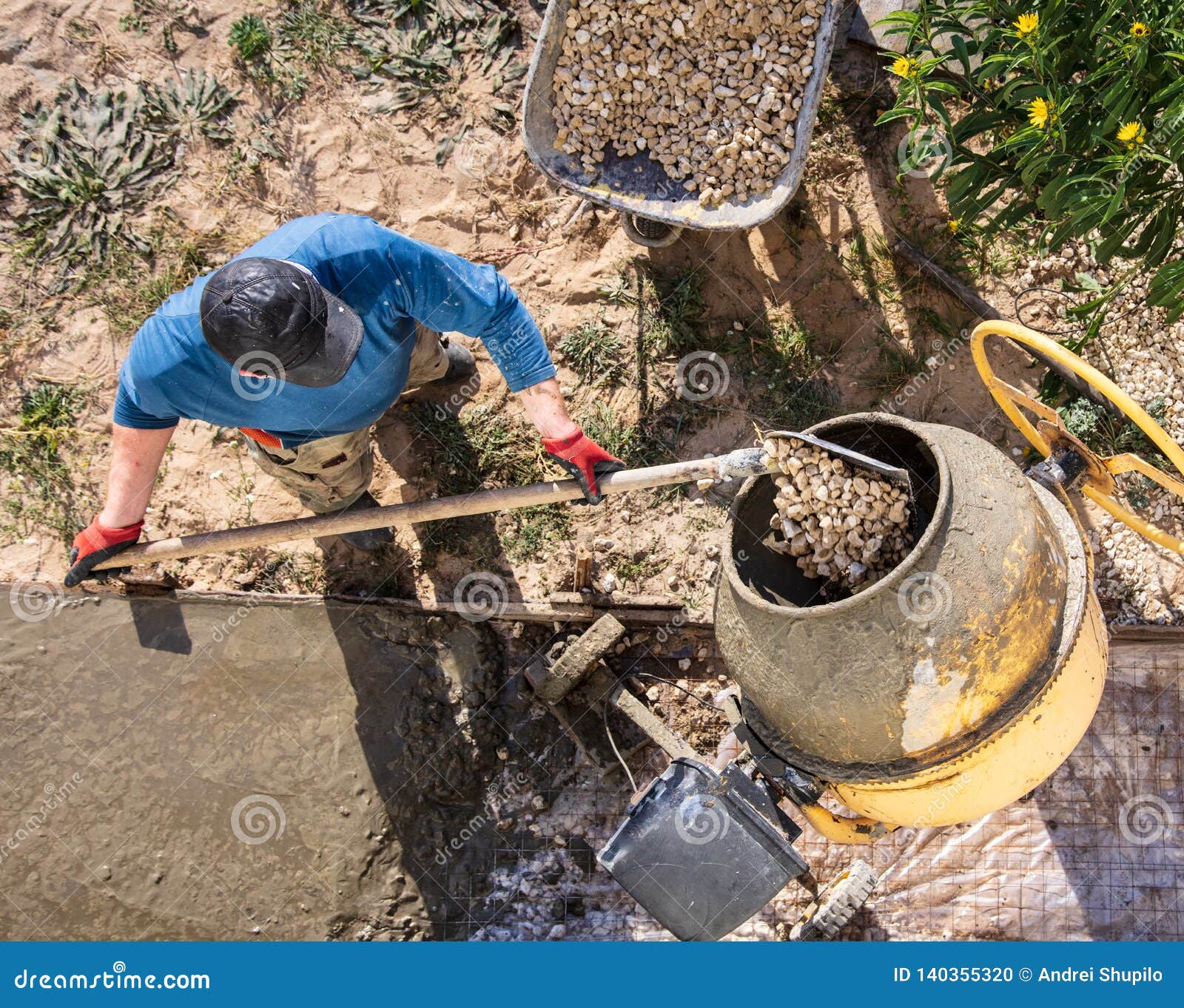 Workers Pour Concrete Solution at a Construction Site Stock Photo ...