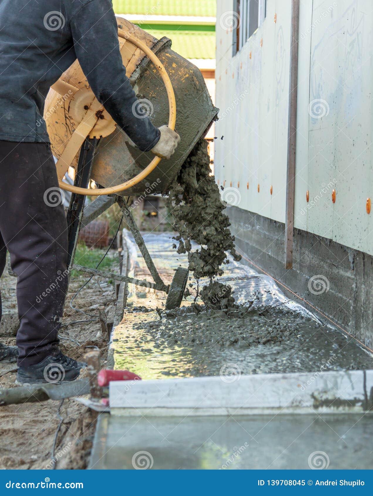 Workers Pour Concrete Solution at a Construction Site Stock Image ...