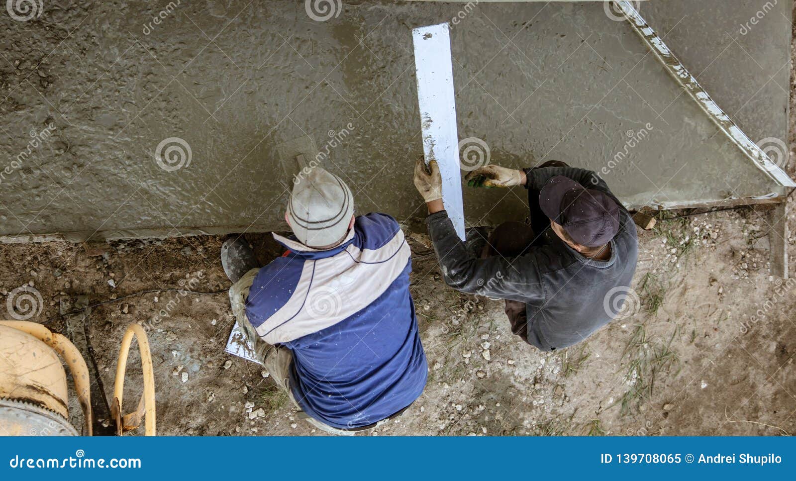 Workers Pour Concrete Solution at a Construction Site Stock Image ...