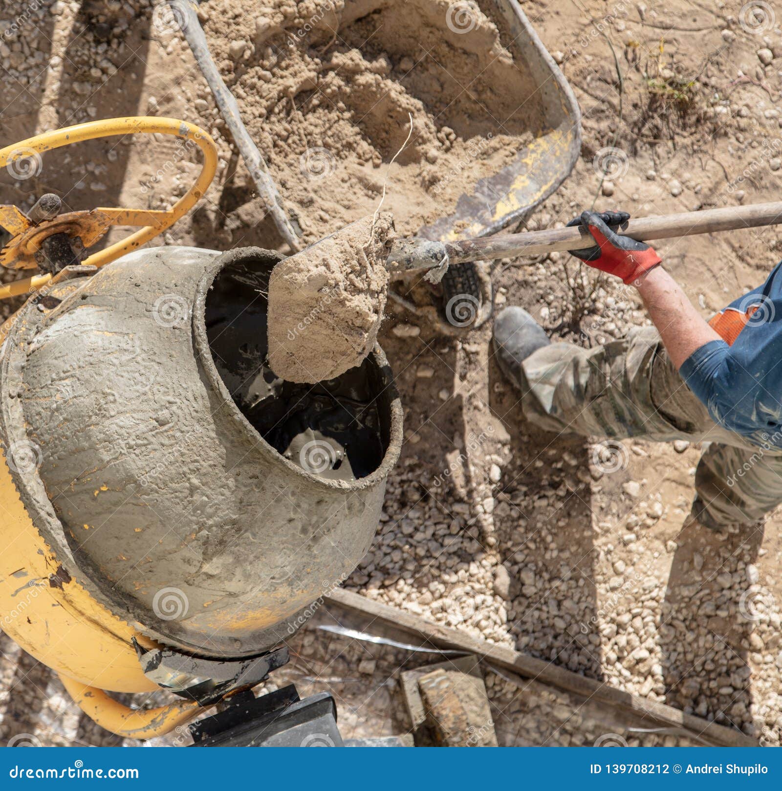 Workers Pour Concrete Solution at a Construction Site Stock Photo ...