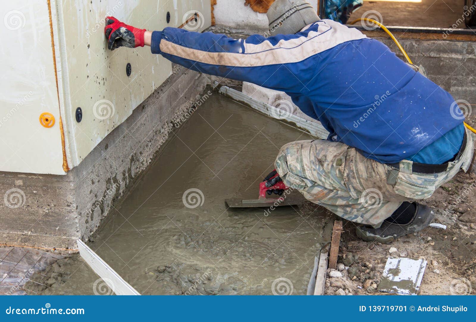Workers Pour Concrete Solution at a Construction Site Stock Image ...