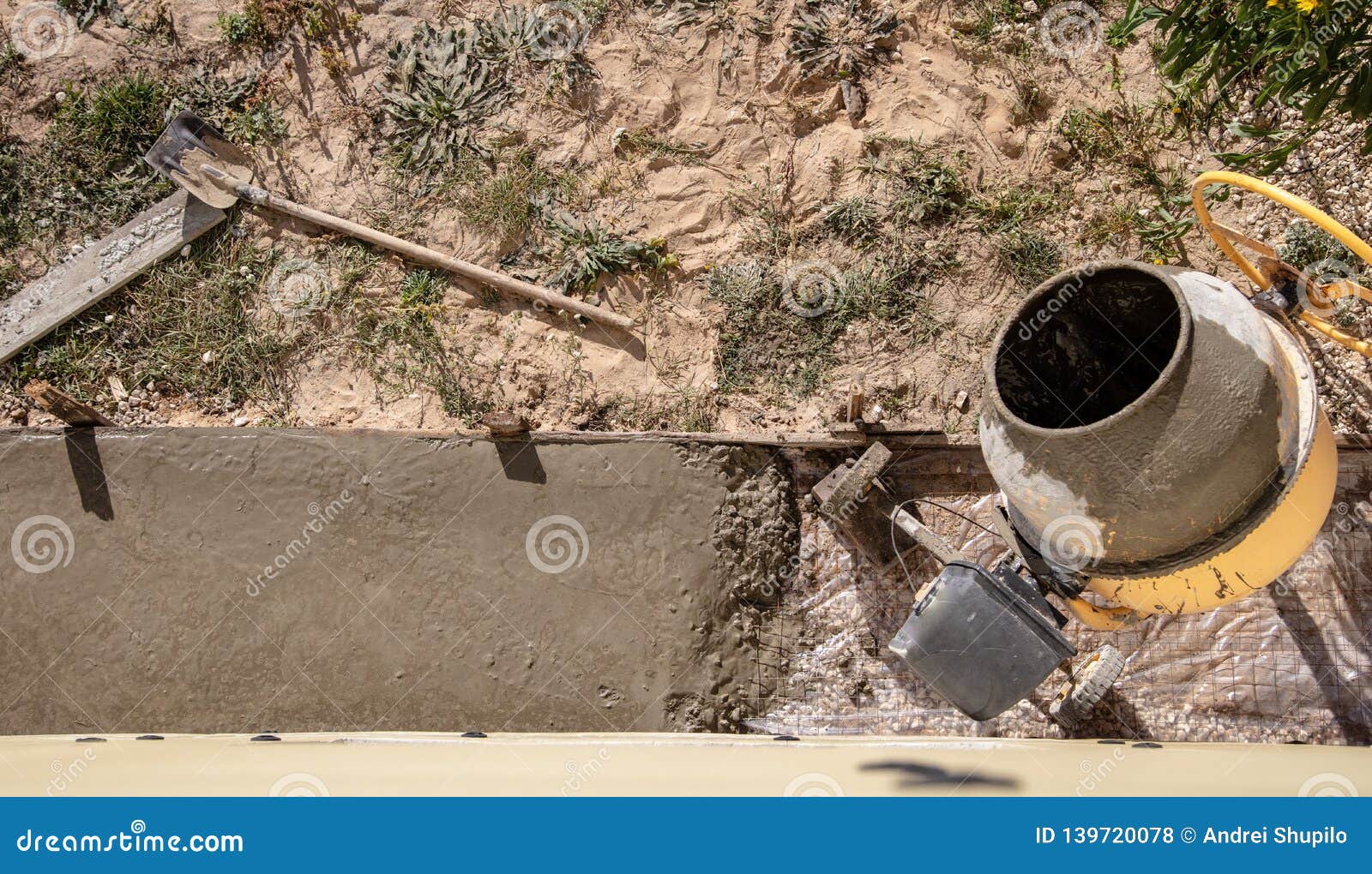 Workers Pour Concrete Solution at a Construction Site Stock Photo ...