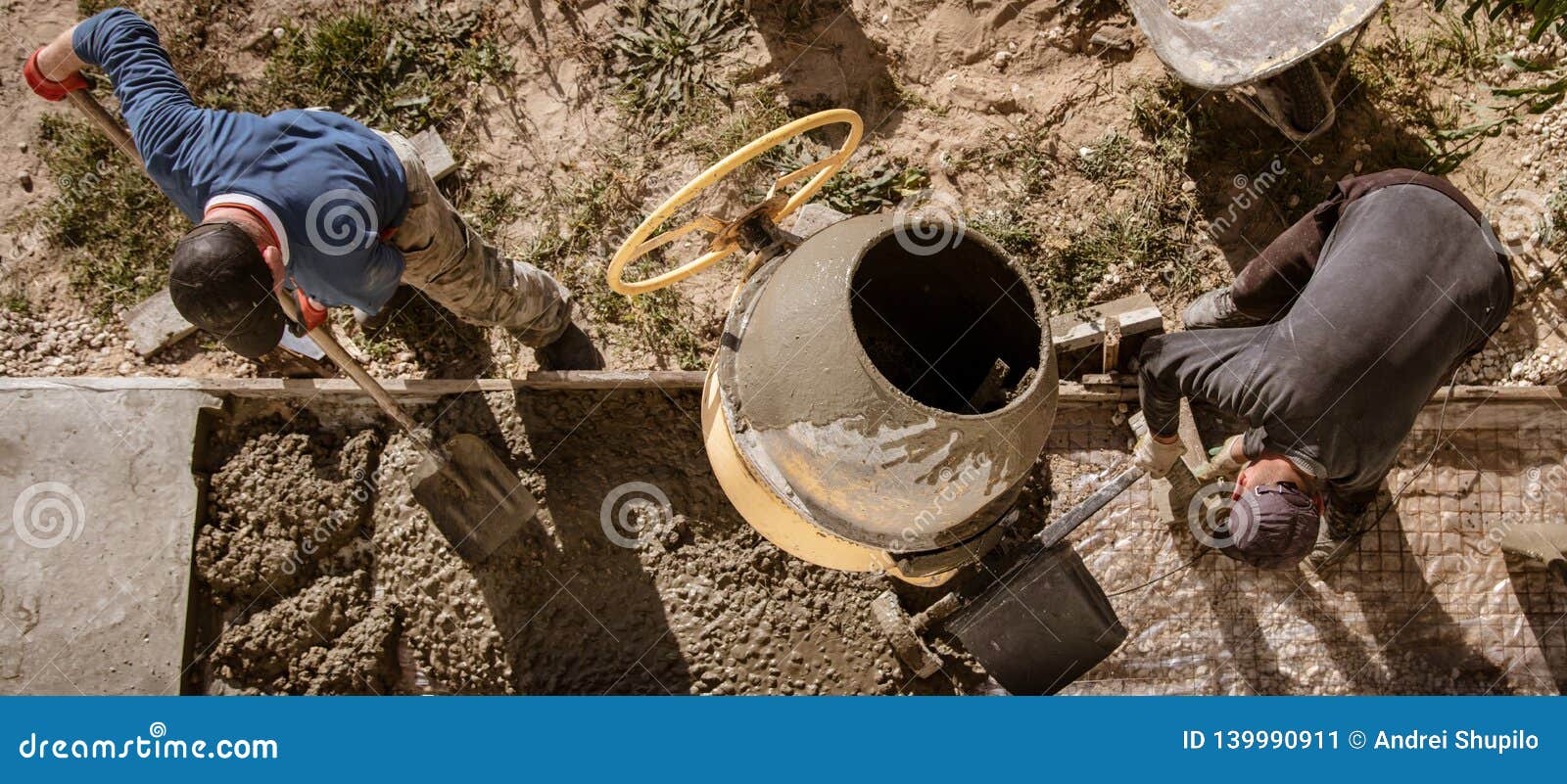 Workers Pour Concrete Solution at a Construction Site Stock Image ...